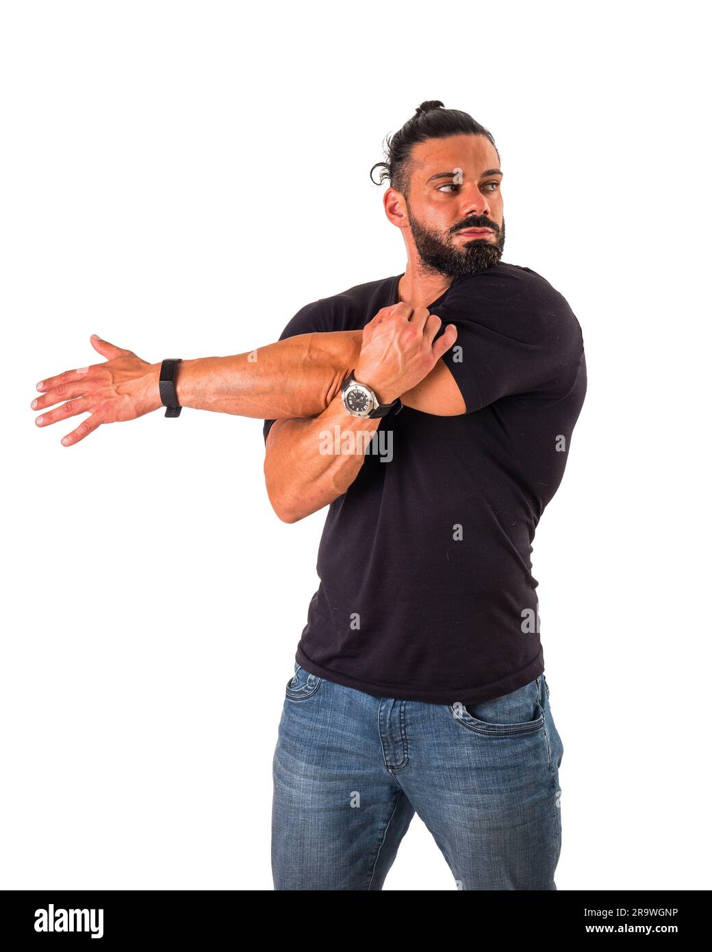 Handsome muscular man stretching arm and shoulder in studio Stock Photo ...