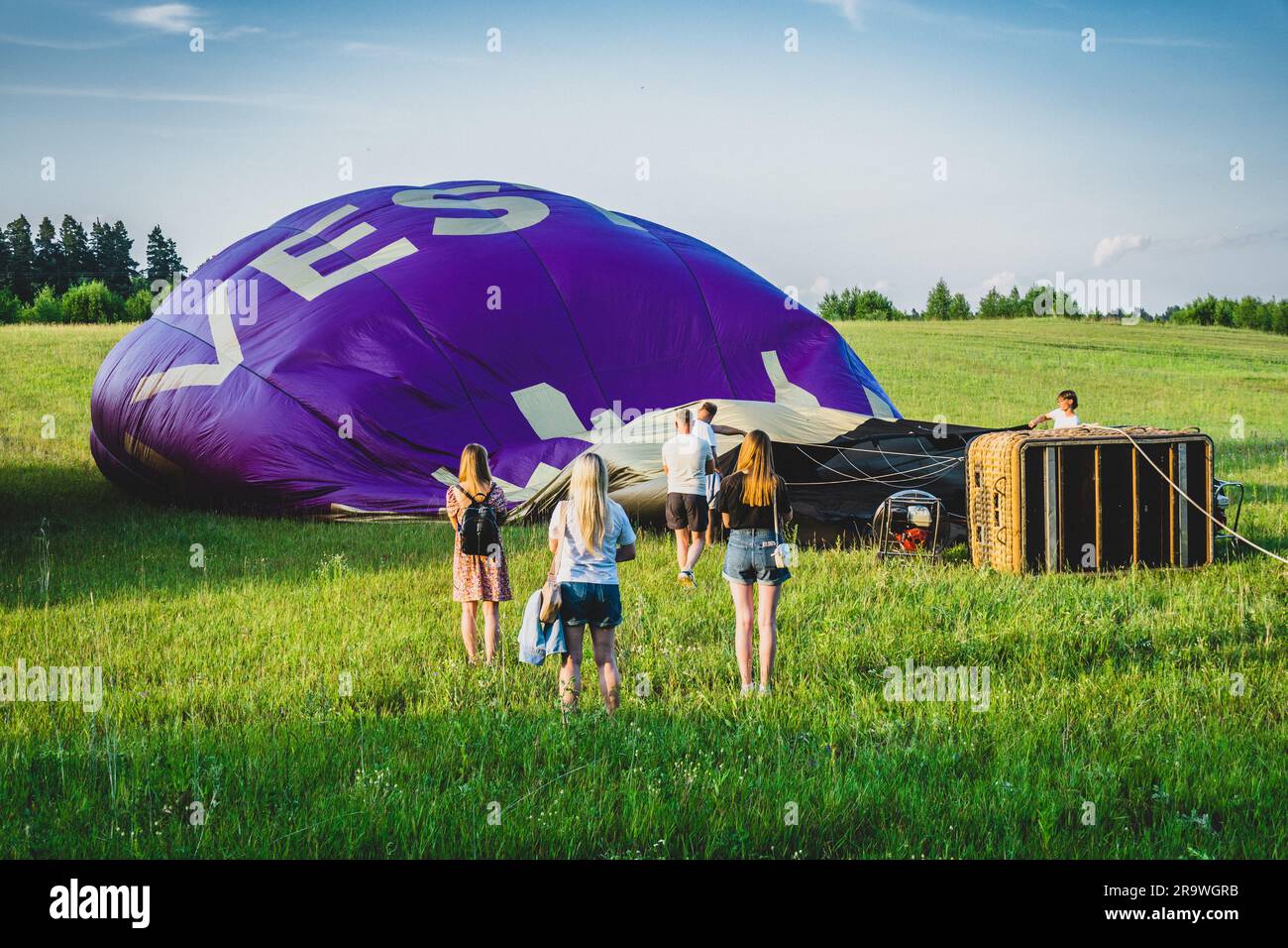 Hot Air Balloon Flight over Trakai. Inflating the hot air balloon in a ...