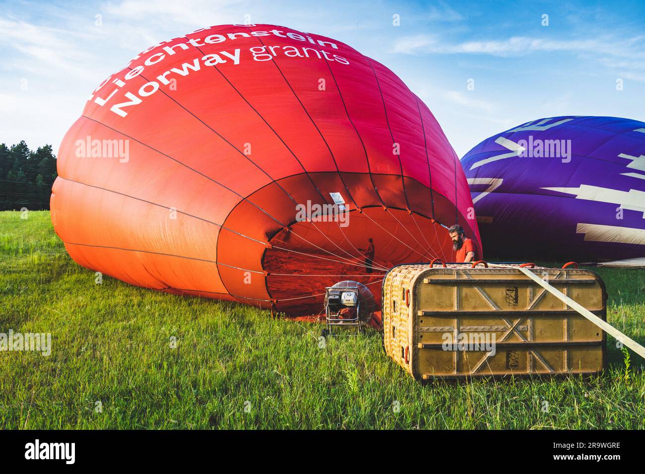 Hot Air Balloon Flight over Trakai. Inflating the hot air balloon in a ...