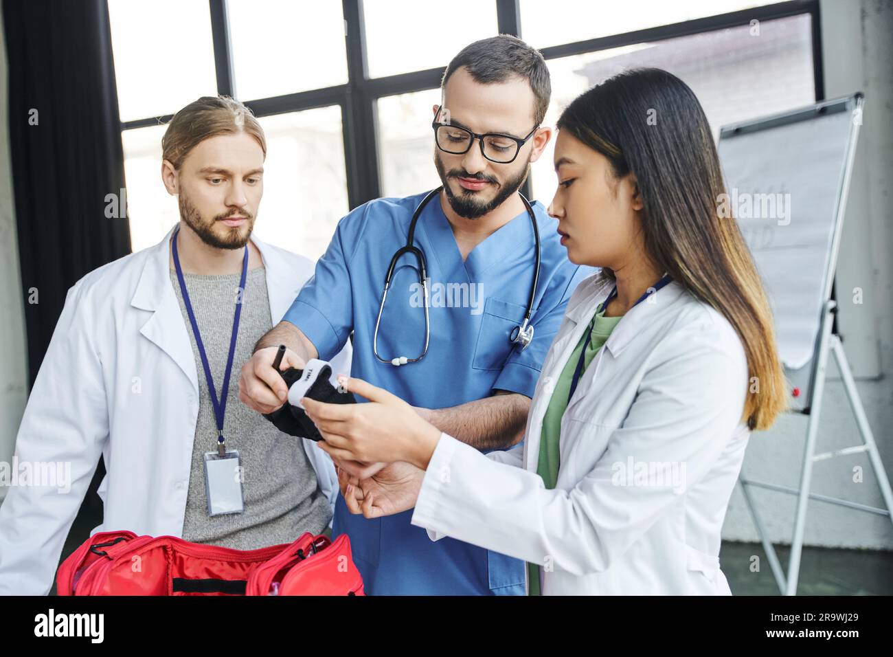 first aid training seminar, medical instructor in eyeglasses and ...