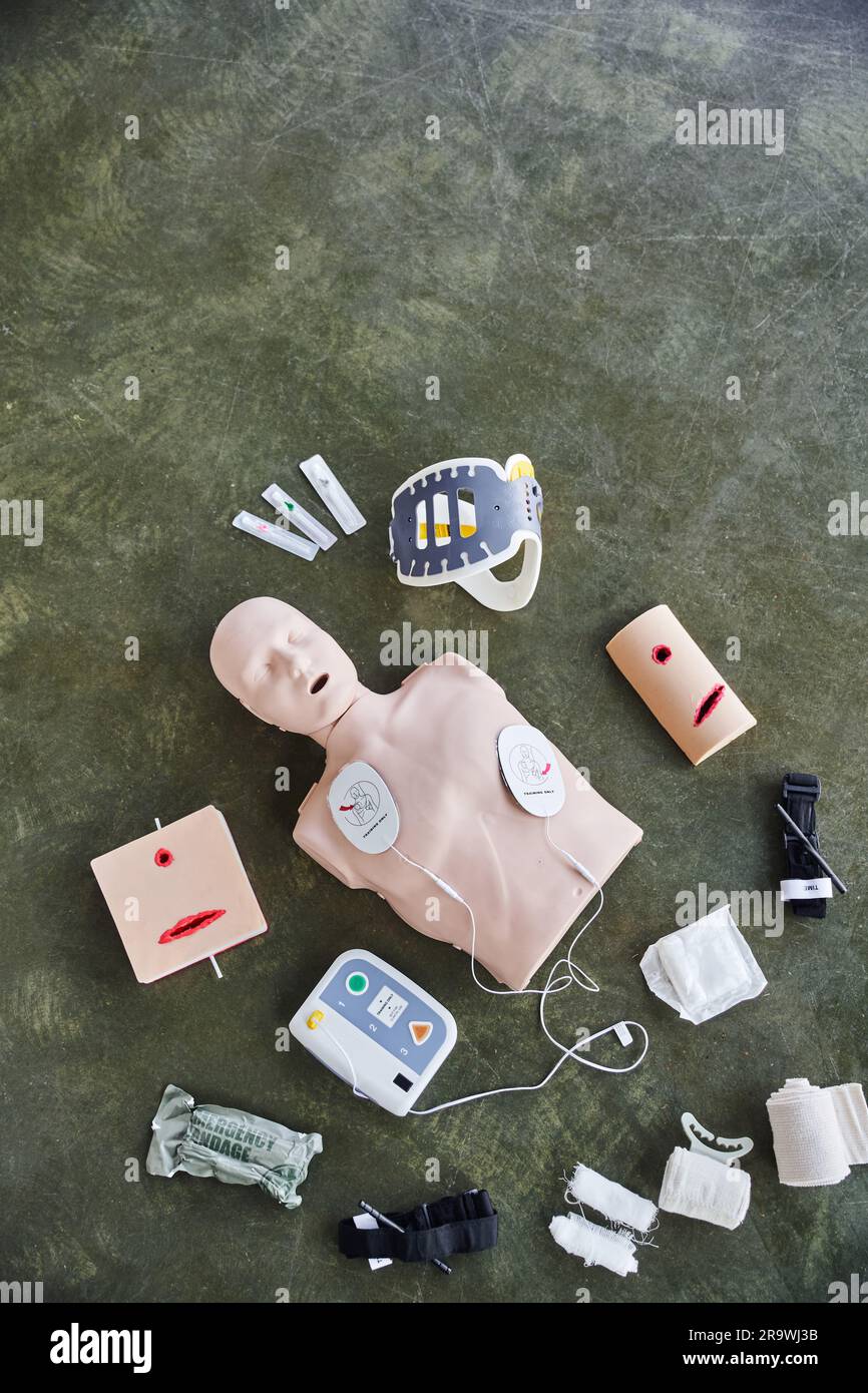 top view of CPR manikin, automated defibrillator, wound care simulators ...