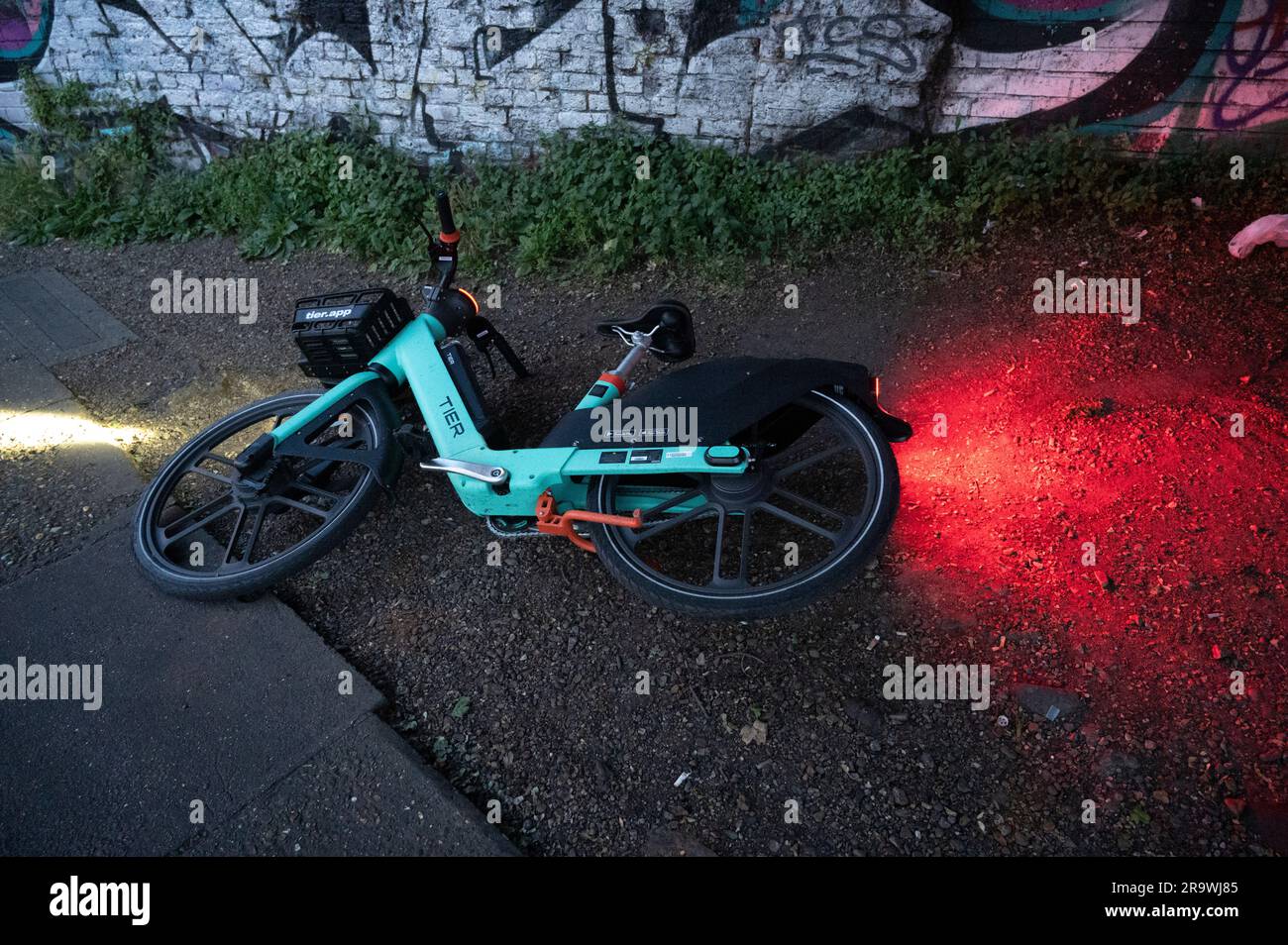 Hackney. London. Electric hire bike abandonned by the canal at night ...