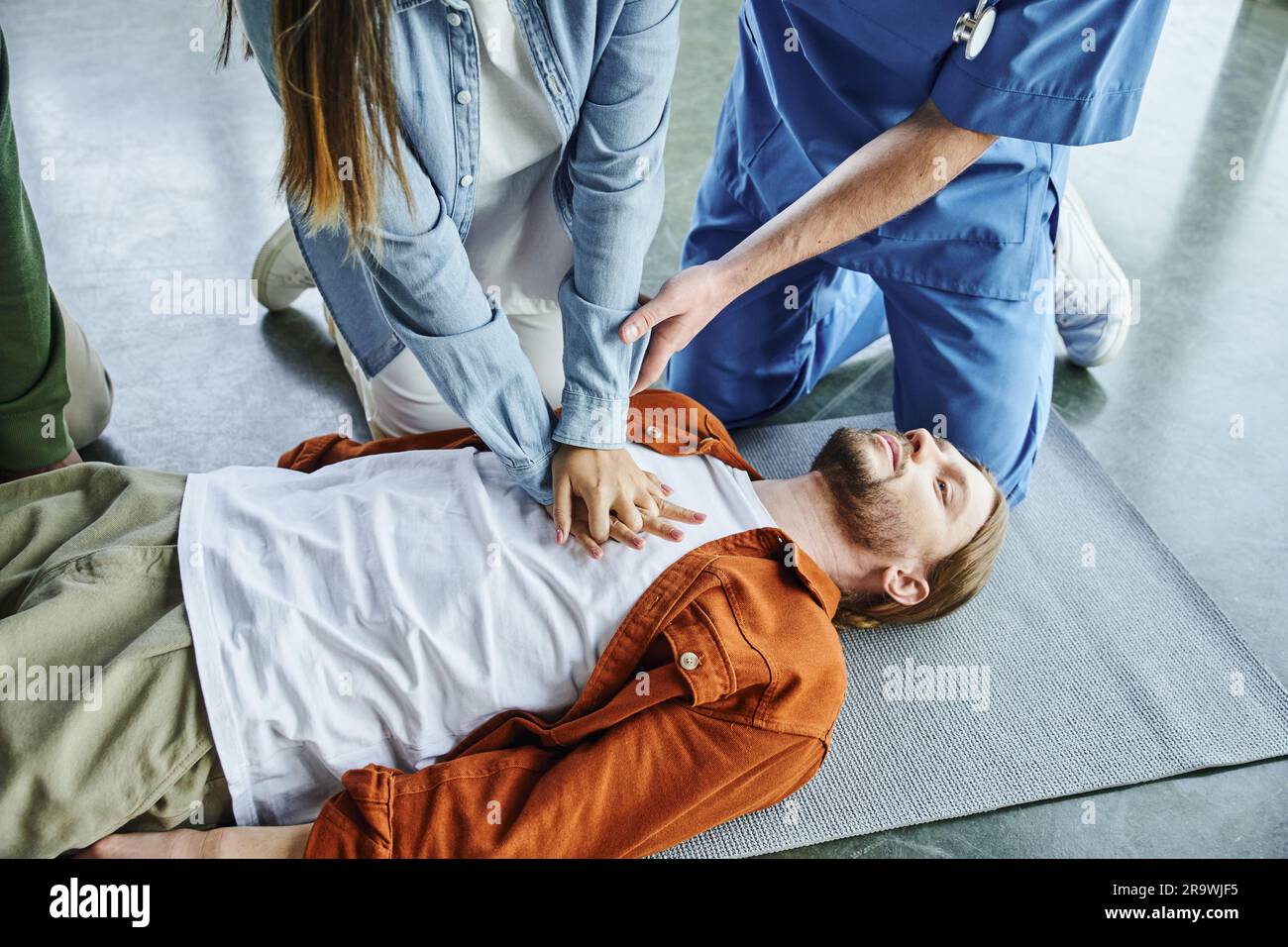 cardiopulmonary resuscitation, professional instructor helping woman ...