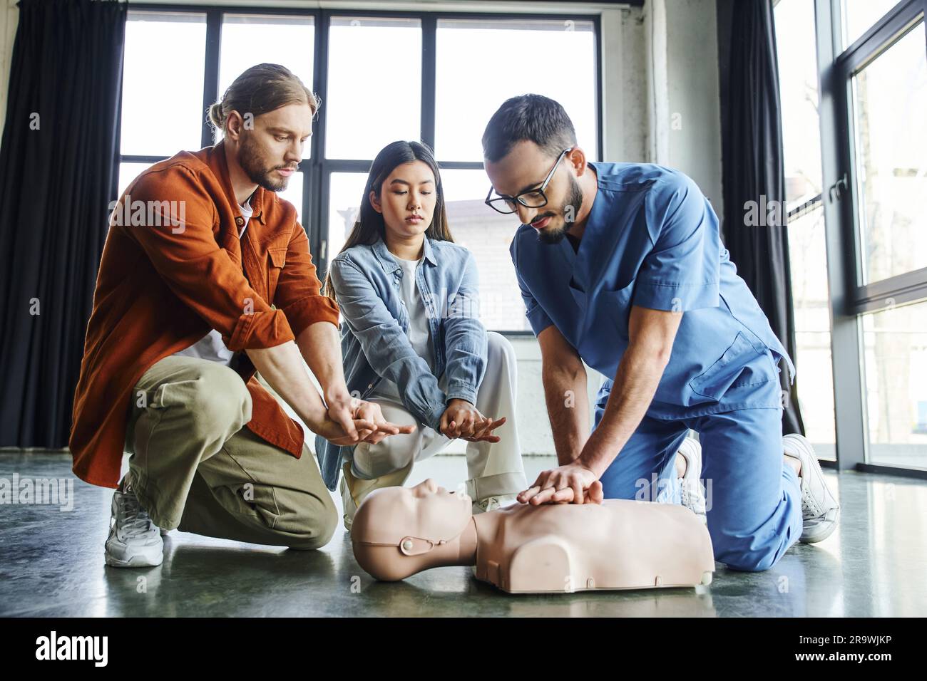 professional paramedic in eyeglasses and uniform showing chest ...