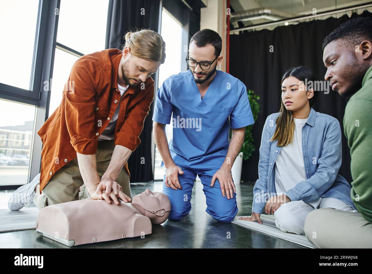 Hands practicing cpr chest compressions hi-res stock photography and images - Alamy