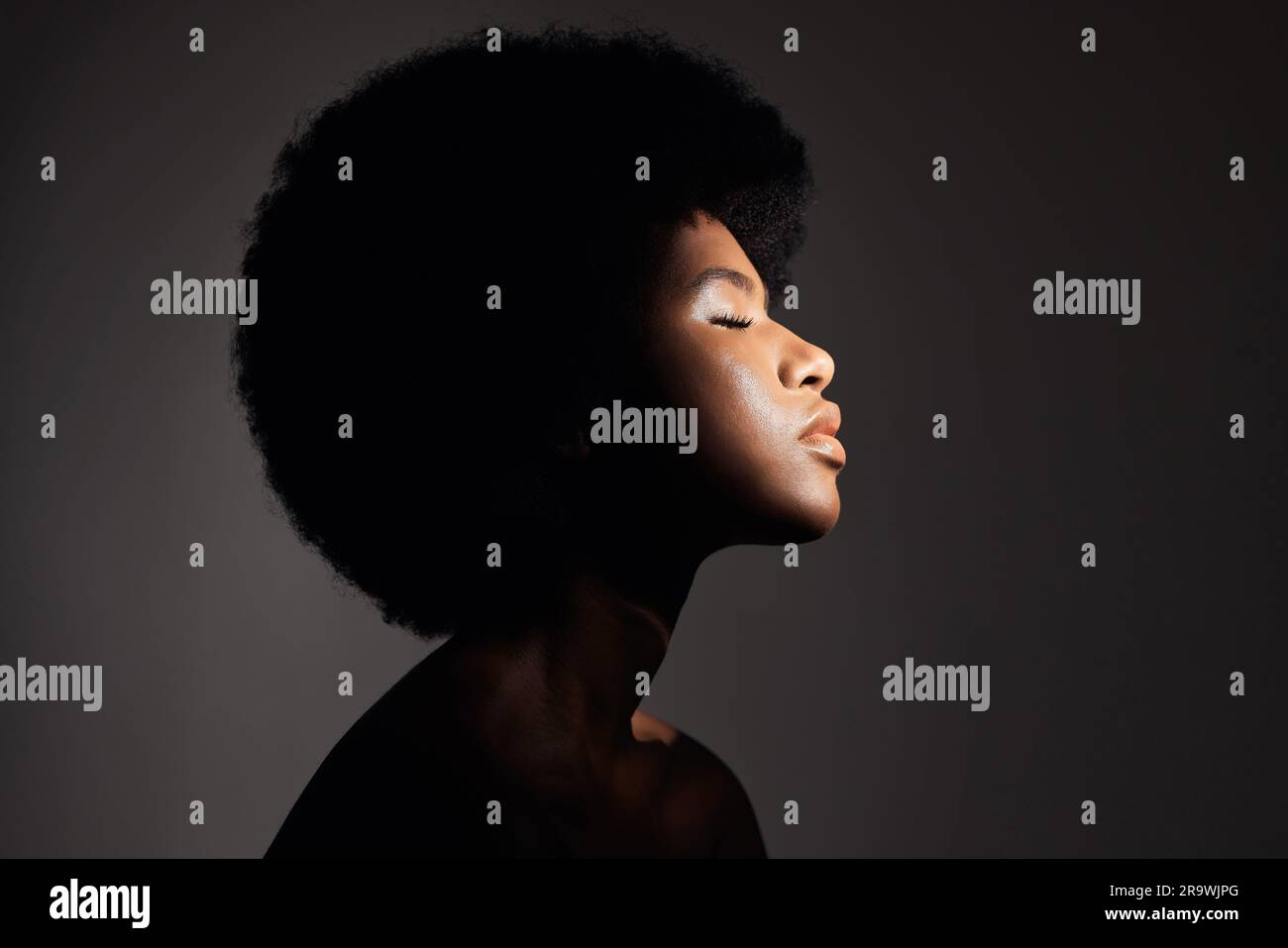 Face shadow, light and black woman with skincare, natural beauty glow ...