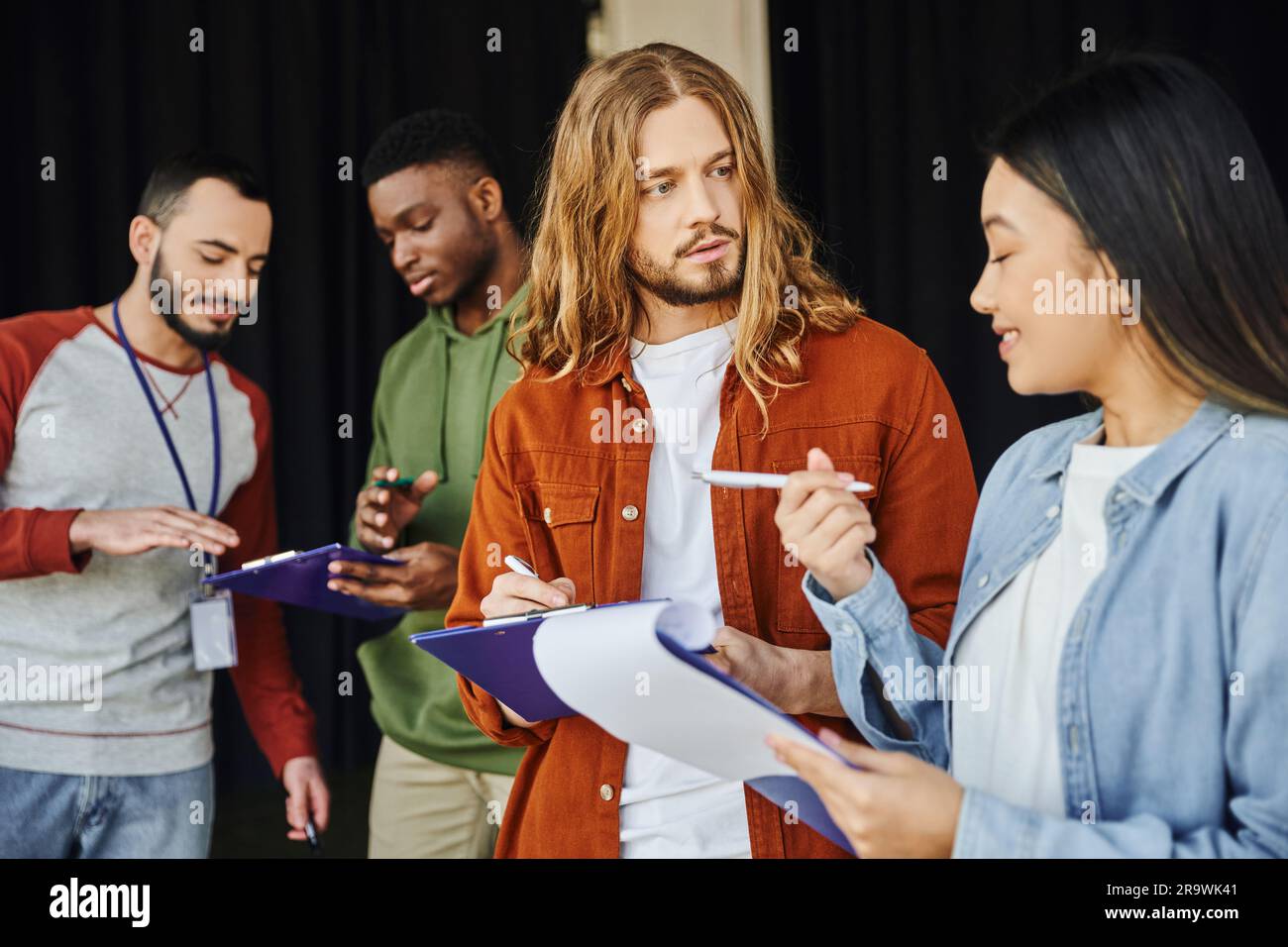 first aid training seminar, smiling asian woman with pen and clipboard ...