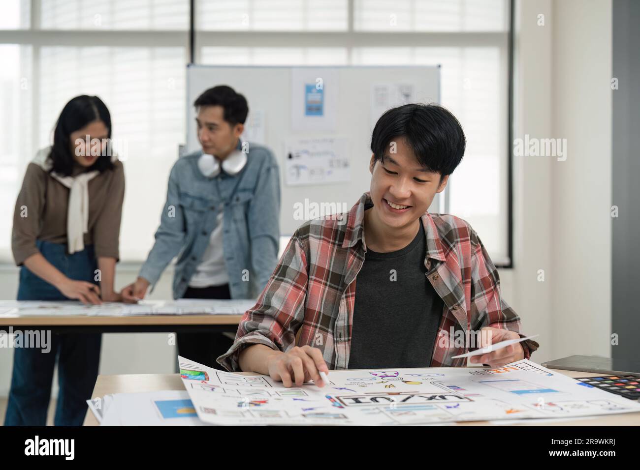 Designer man with computer and laptop planning application for mobile ...