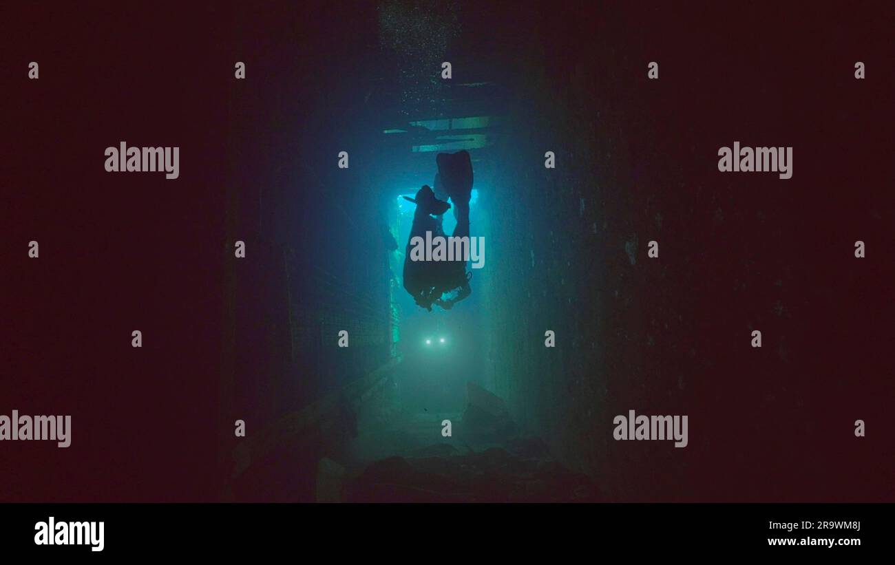 Scuba diver swim inside of ferry Salem Express shipwreck, Red sea ...