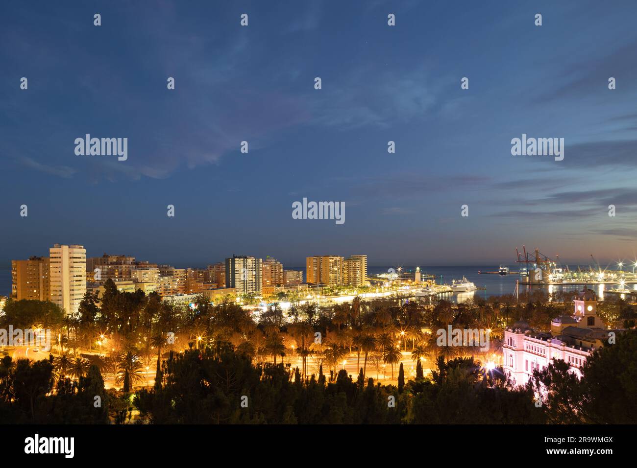 The La Malagueta district with Muelle Uno at blue hour, Malaga, Spain ...