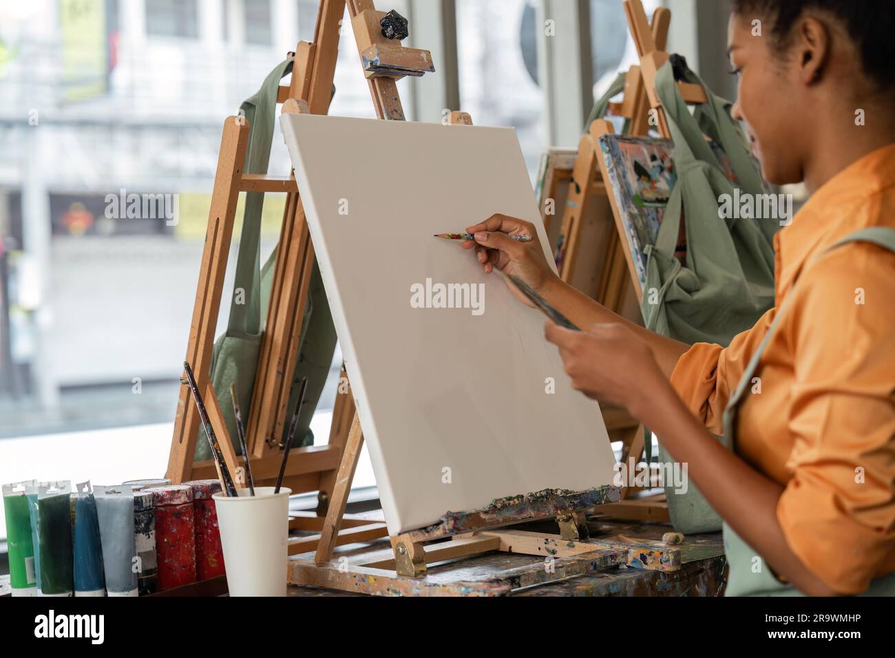 artist with pencil sketch picture at art studio Stock Photo - Alamy