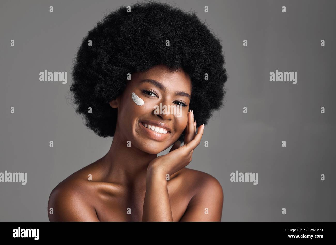 Black woman, cream on face and beauty with cosmetics product, skincare ...