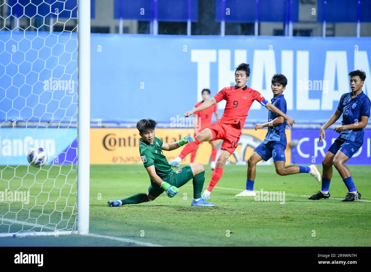 Kim Myung-Jun(No.9) of Korea Republic and Tissanu Khuptanawin of ...