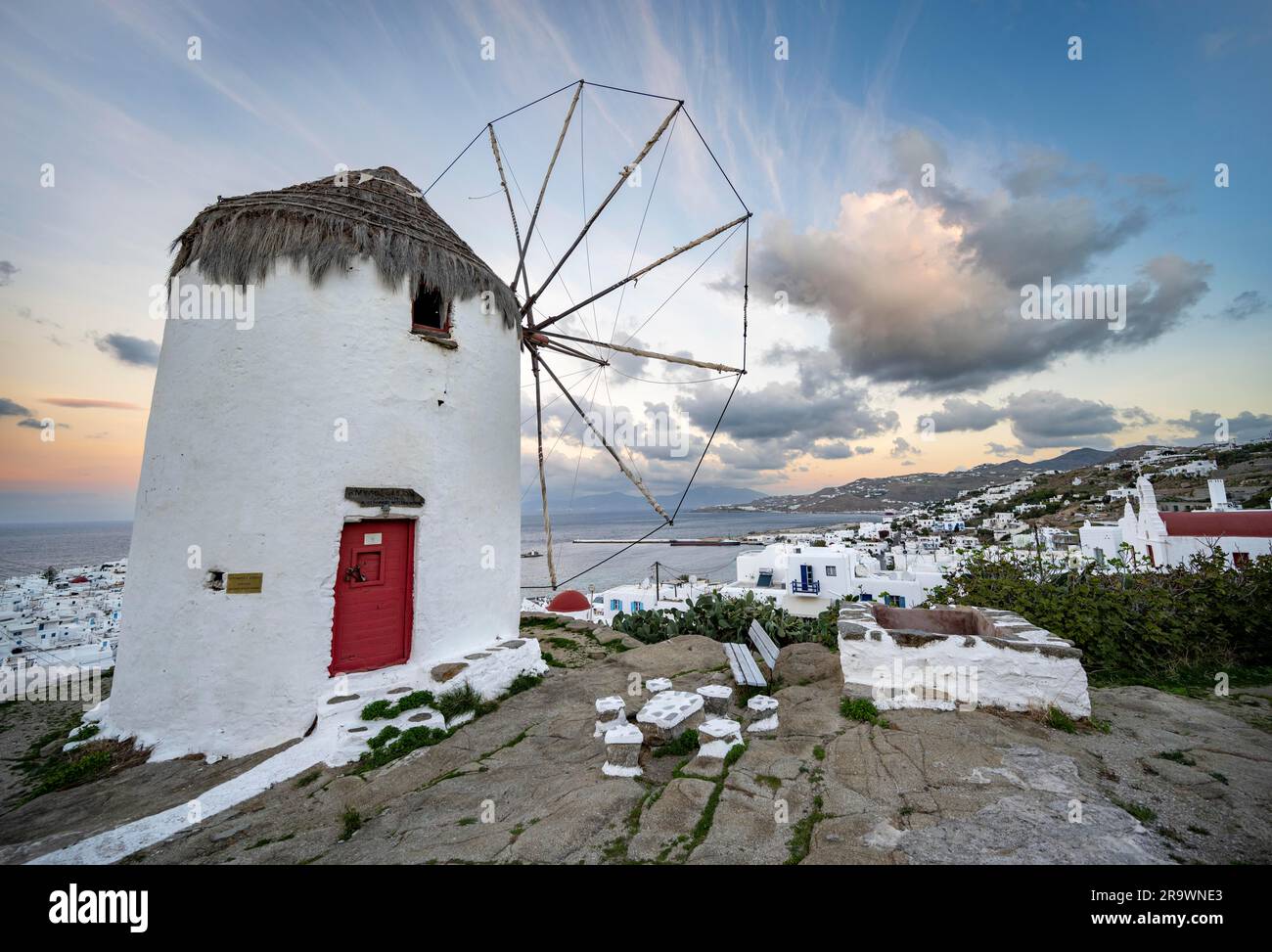 Bonis windmill at sunrise, view over white Cycladic houses, island and ...