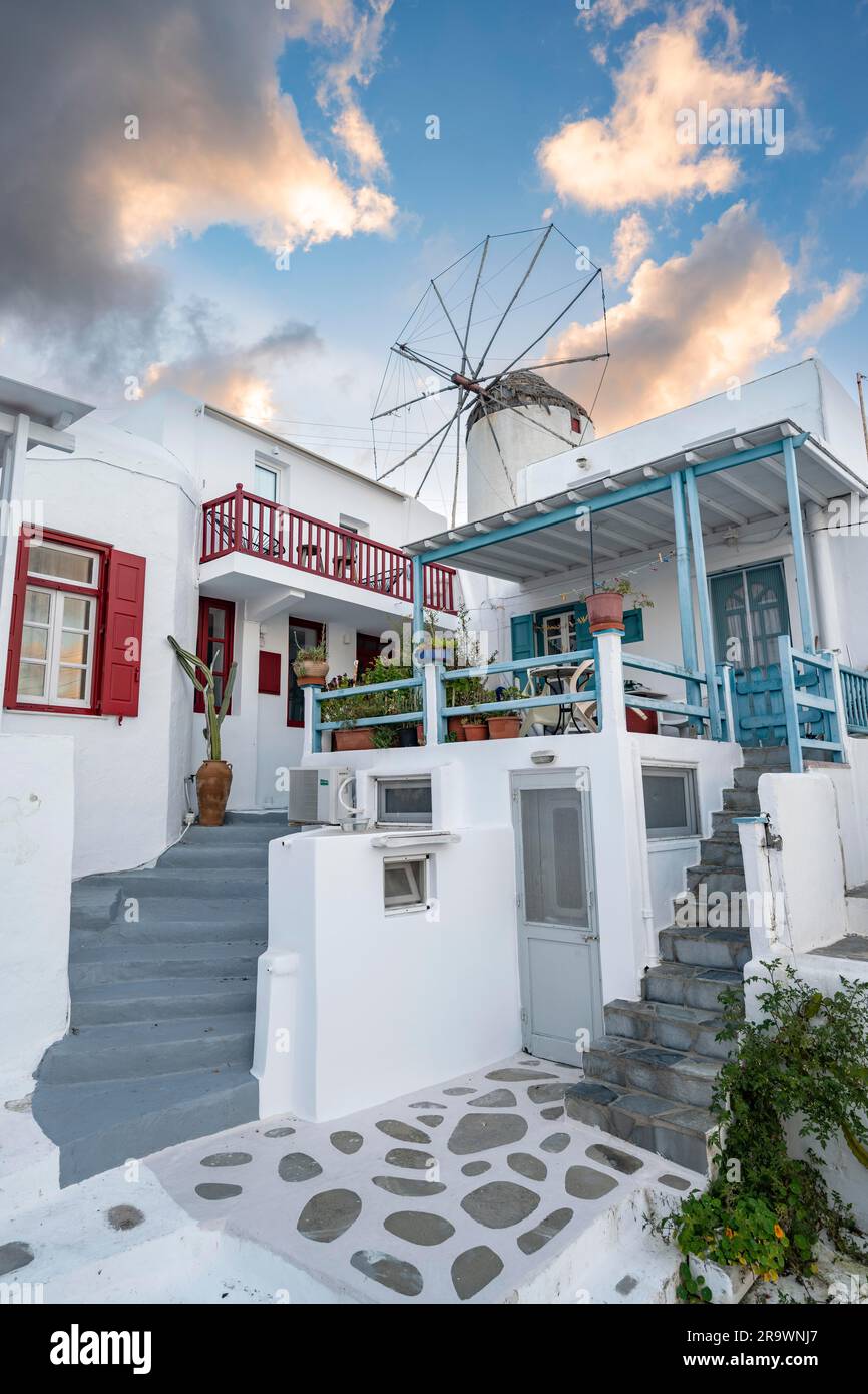 Cycladic white houses with colourful shutters, Bonis windmill in the ...