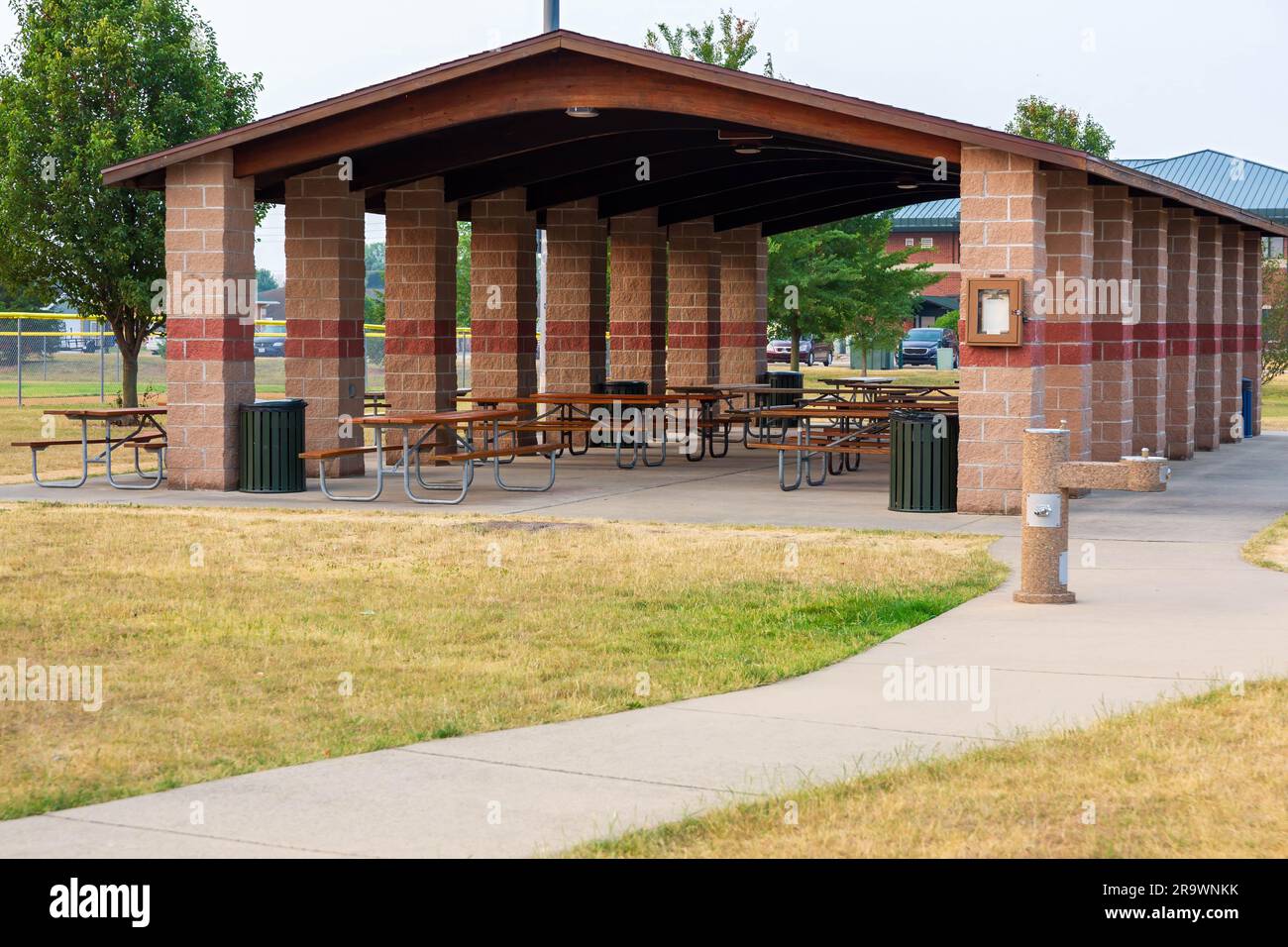 picnic tables in a pavilion are ready for the days visitors Stock Photo ...