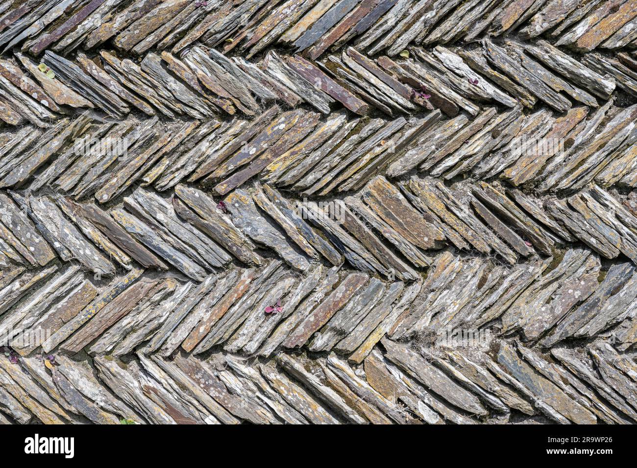 Slate slabs stacked in a herringbone pattern to form a wall, Full-size ...