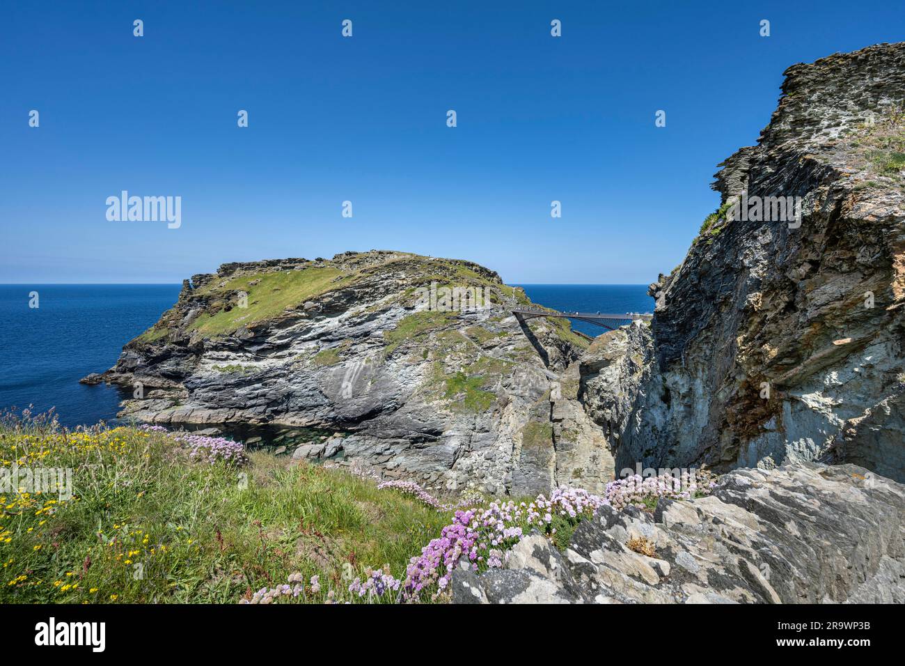 Rough cliffs with the Tintagel Peninsula and the ruins of Tintagel ...