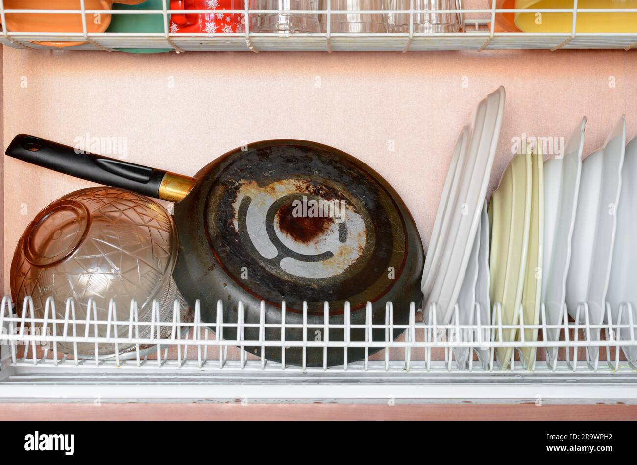 Drying dishes, pan, cups and glasses in the dish rack Stock Photo - Alamy