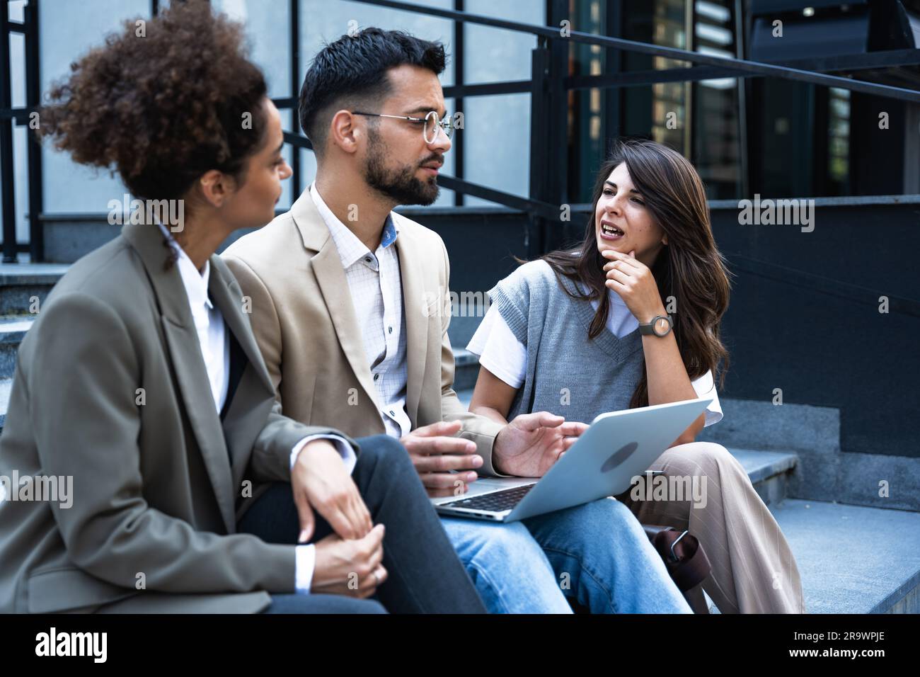 Business people outdoor meeting. Company staff businessmen and ...