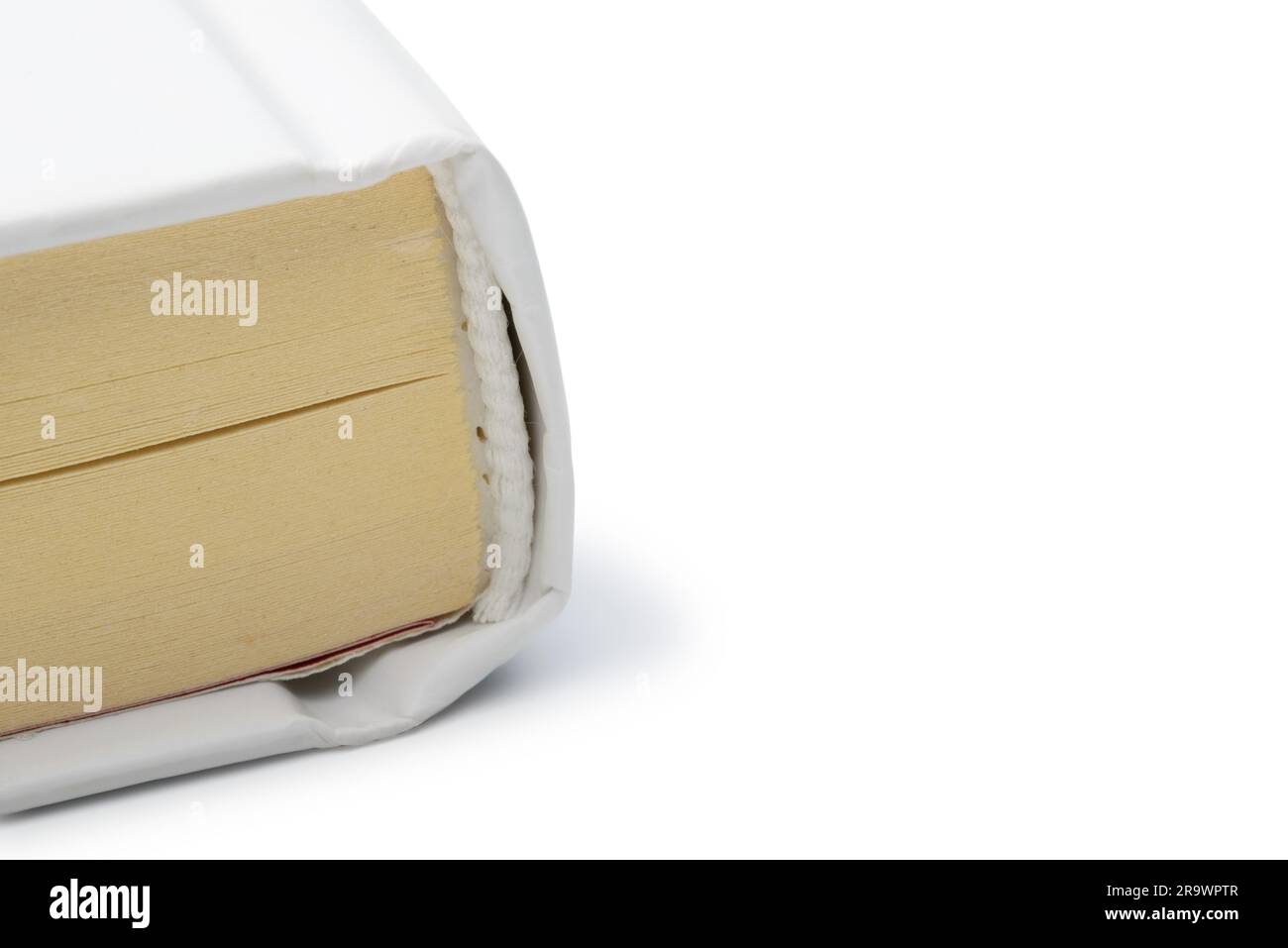 Macro detail of a big white book on white background Stock Photo - Alamy