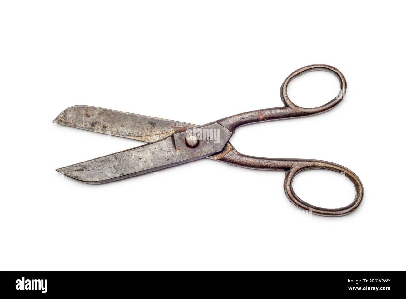 Big old rust iron scissors isolated on white background Stock Photo - Alamy
