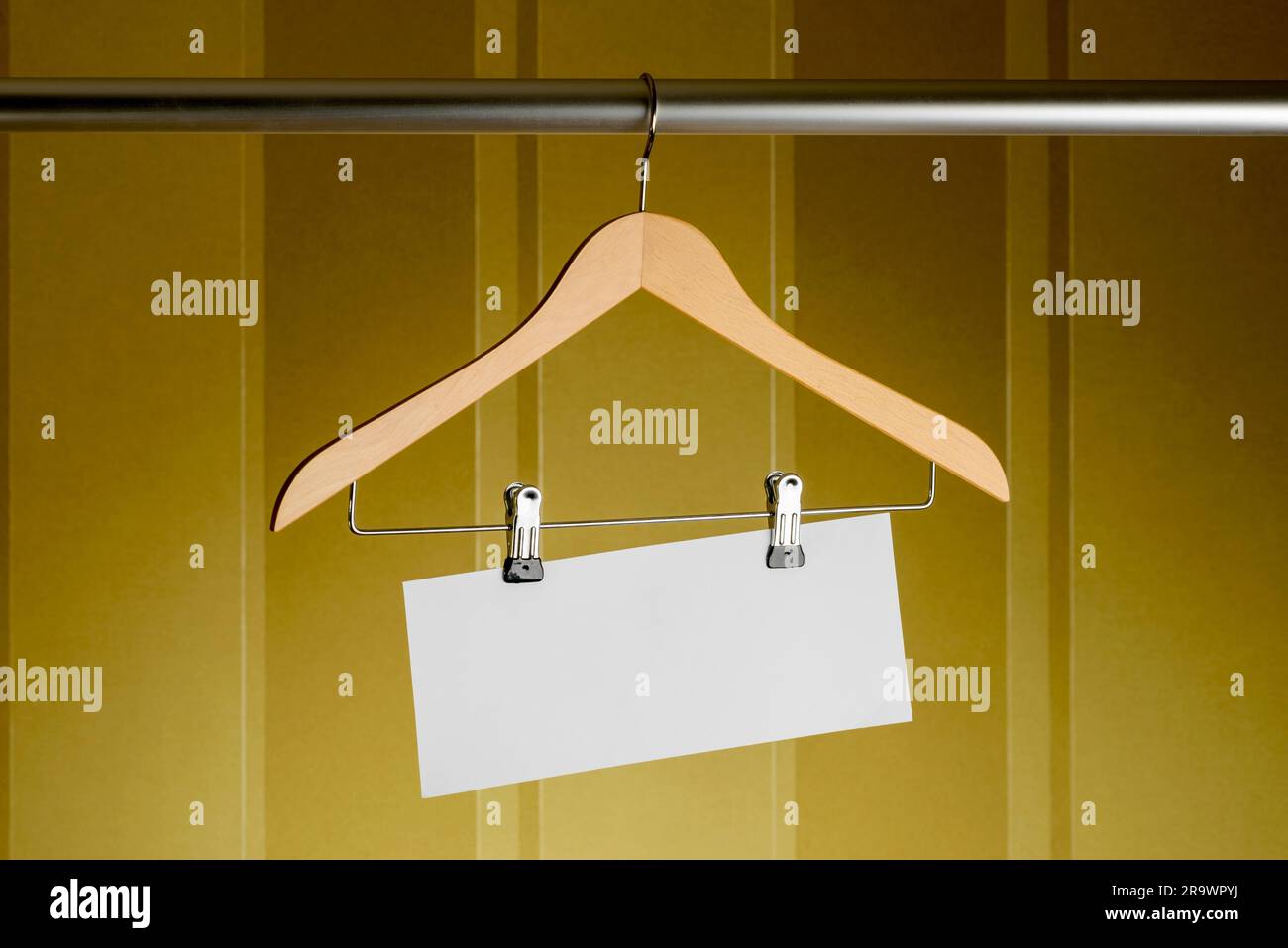 Clothes hanger with a white blank tag where to put text Stock Photo - Alamy