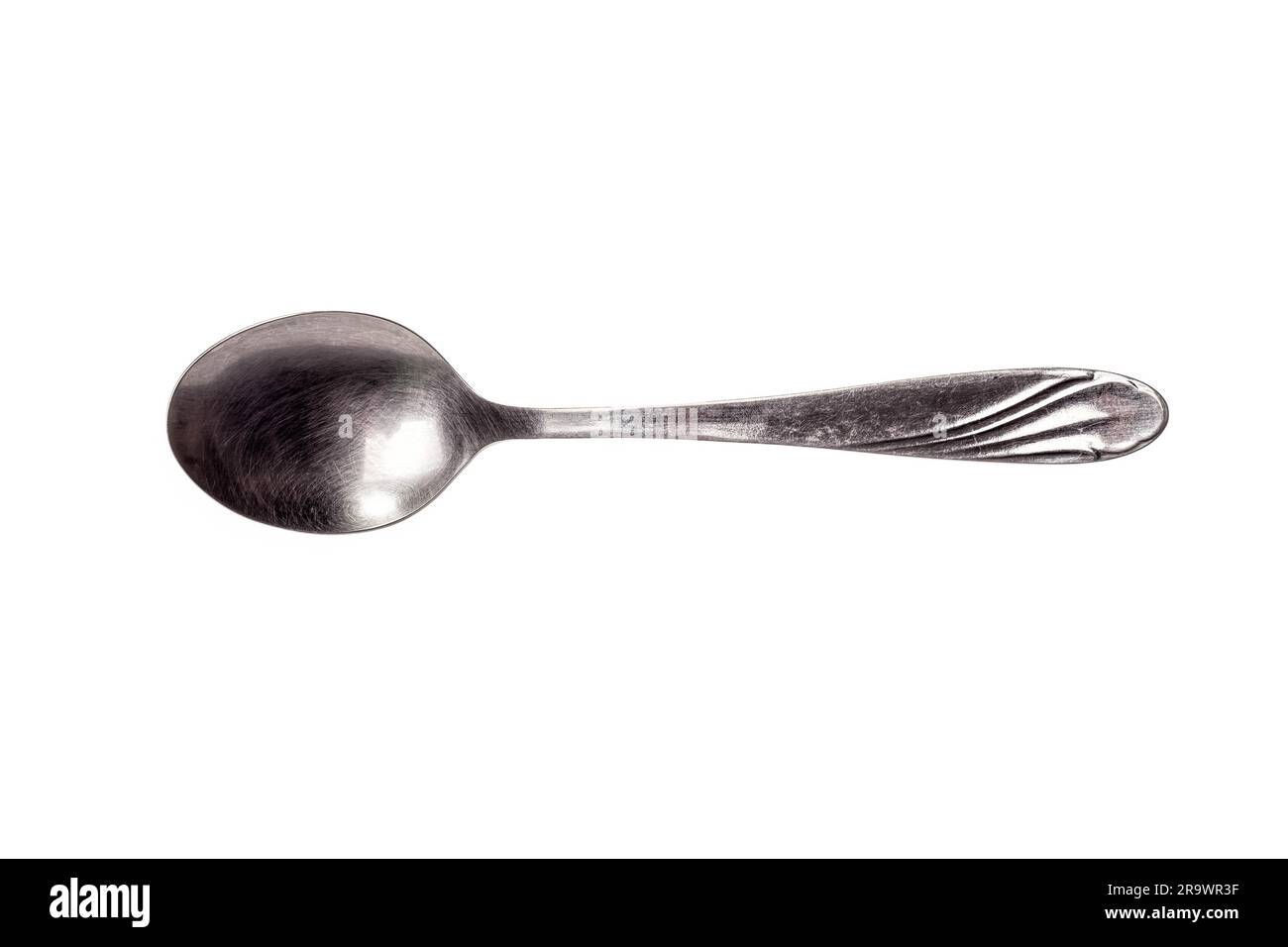 A soviet style metallic stainless inox coffee spoon with decorations ...