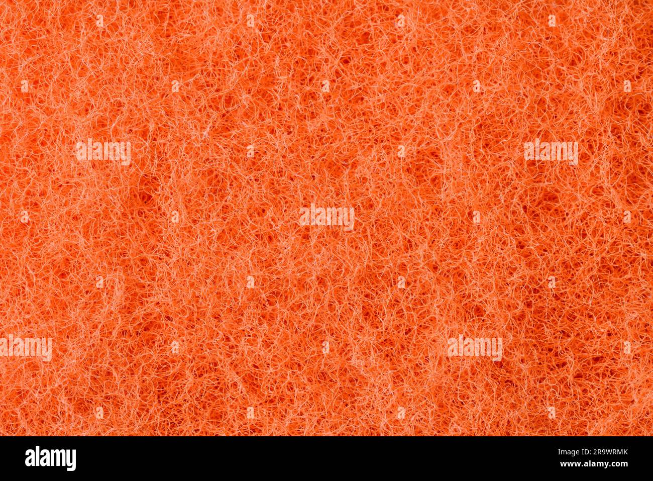 Macro of orange synthetic sponge texture, scrub side Stock Photo - Alamy