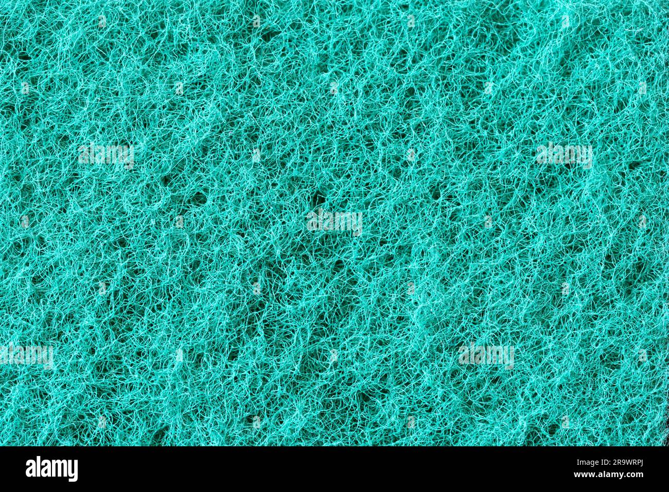 Macro of green synthetic sponge texture, scrub side Stock Photo - Alamy