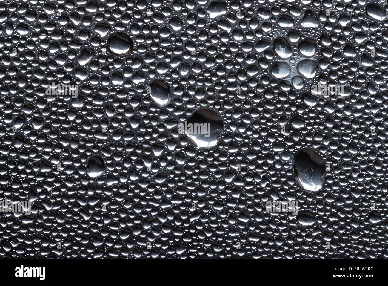 Many little water drops due to condensation on a plastic bottle curved ...