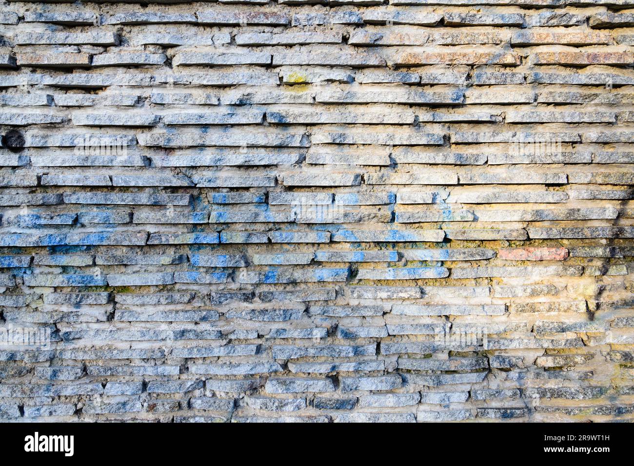 Stone wall texture under a changing light Stock Photo - Alamy