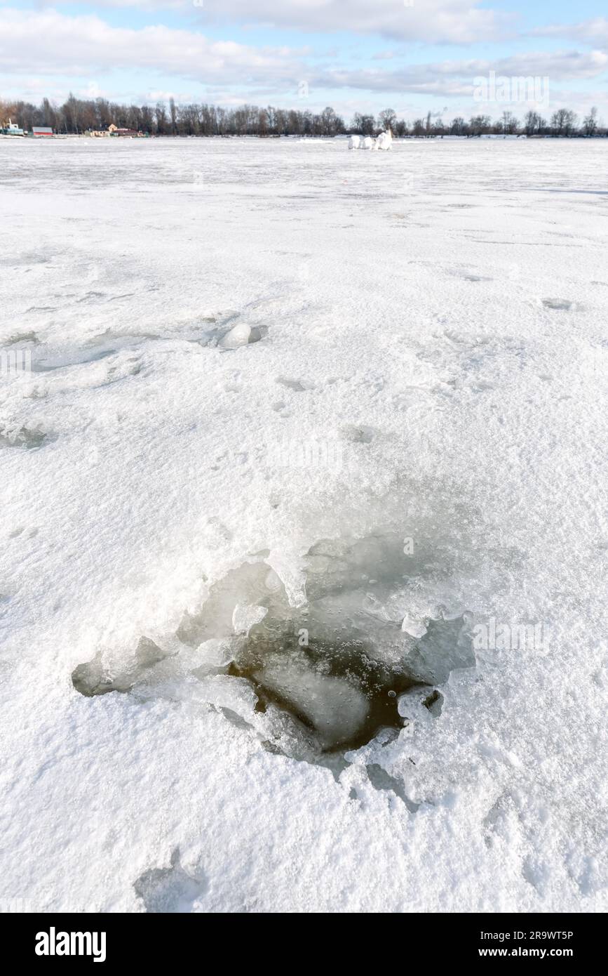 Detail of a hole in the ice on the frozen Dnieper river in Kiev ...