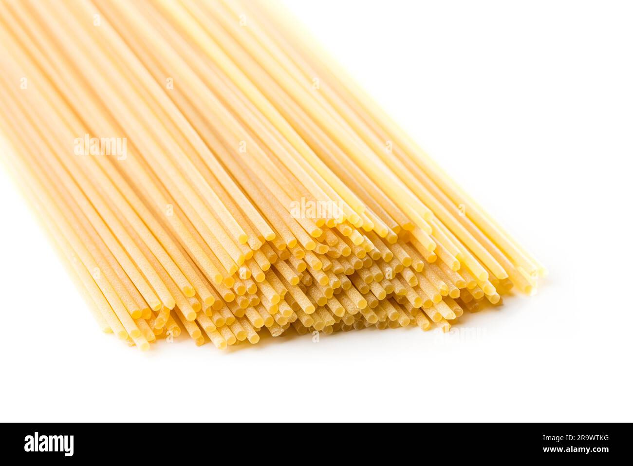 Italian spaghetti extruded through bronze, on white background Stock ...