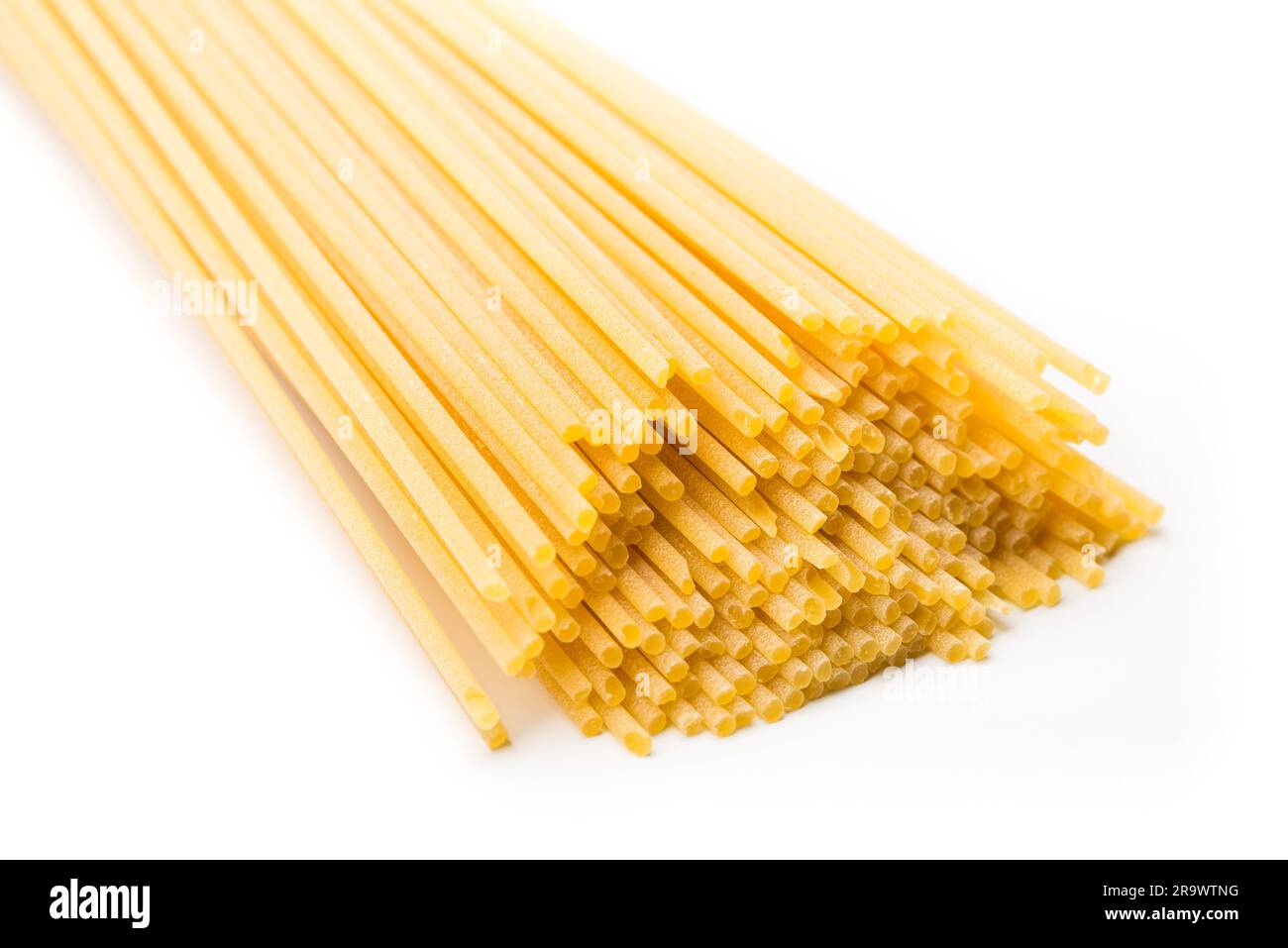 Italian spaghetti extruded through bronze, on white background Stock ...
