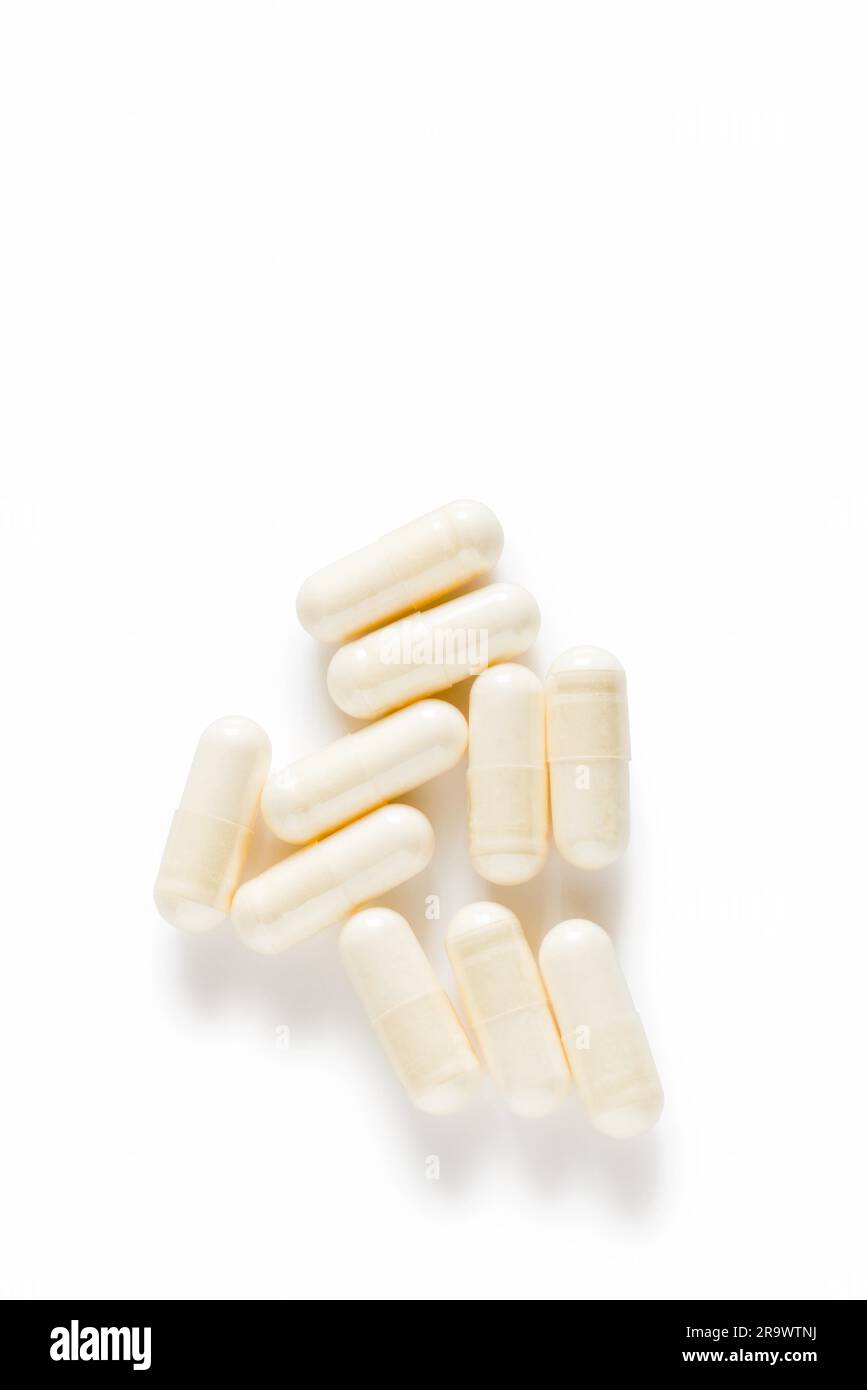 Ten yoghurt capsules isolated on a white background. Yoghurt Capsules ...