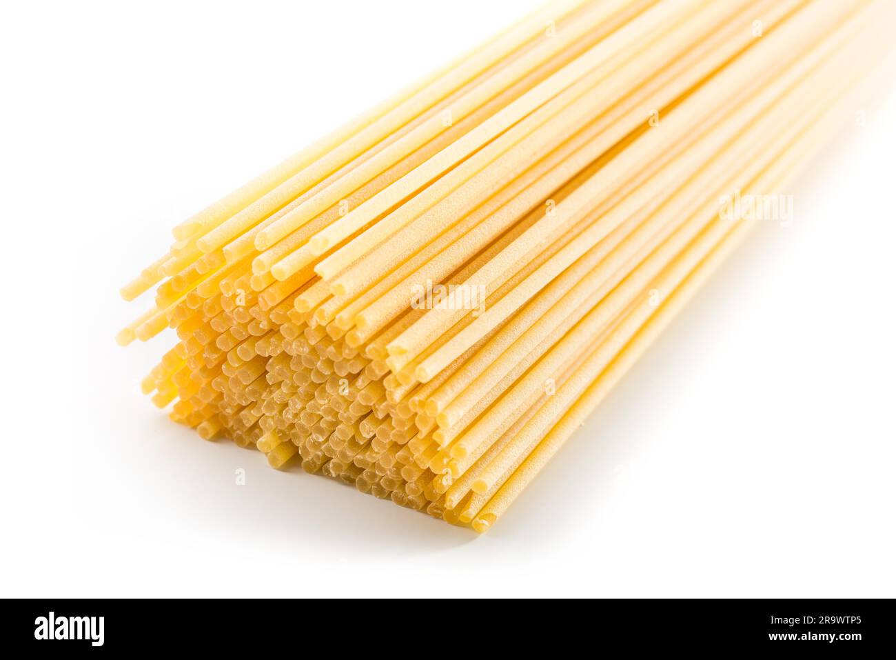 Italian spaghetti extruded through bronze, on white background Stock ...