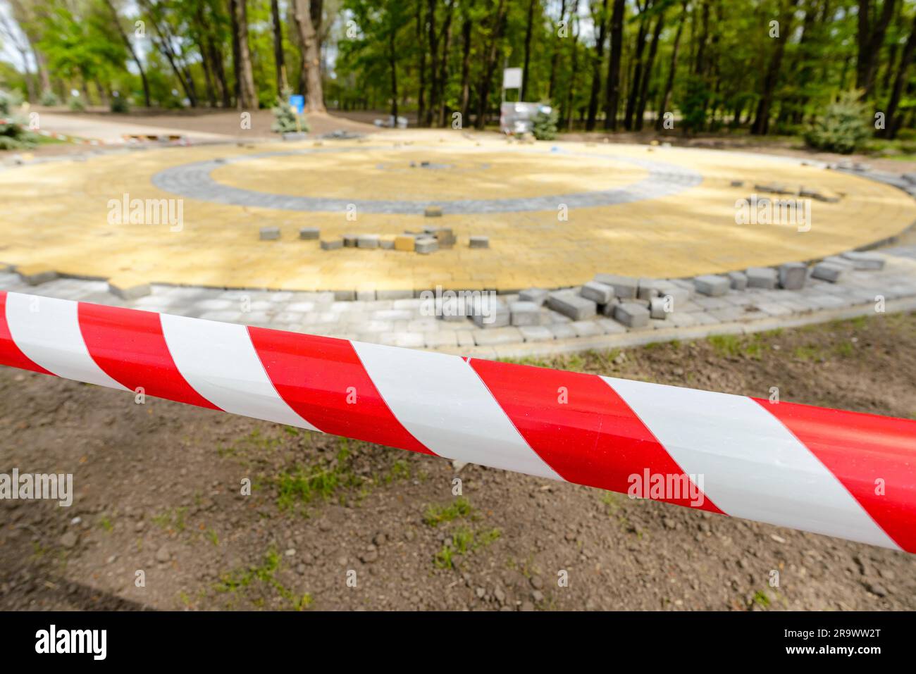 Red and white striped tape defining the border of a dangerous zone of ...
