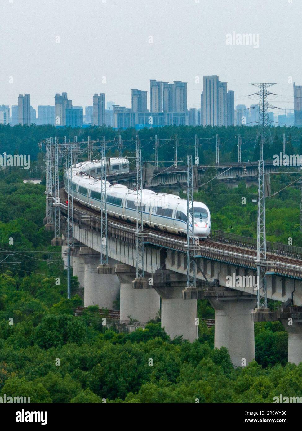 HEFEI, CHINA - JUNE 29, 2023 - A bullet train runs on a railway in ...