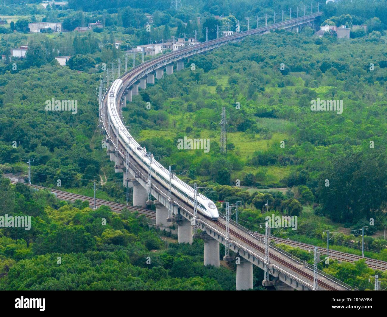 HEFEI, CHINA - JUNE 29, 2023 - A bullet train runs on a railway in ...
