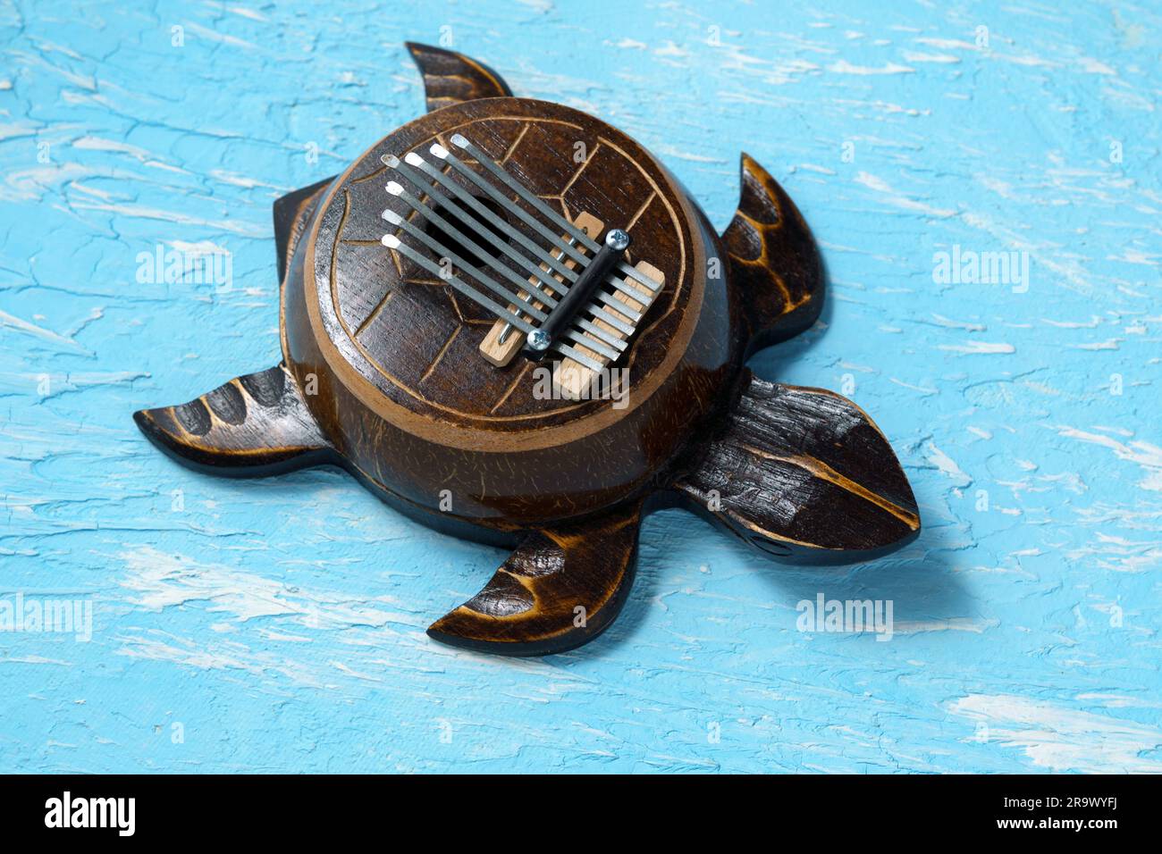 Kalimba turtle on a blue background. Traditional instrument from Africa ...