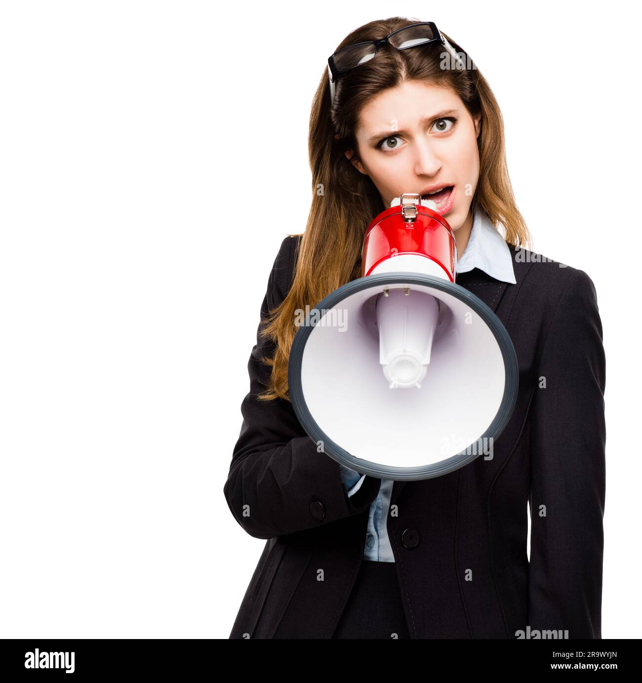 Megaphone, portrait and a business woman in studio for serious ...