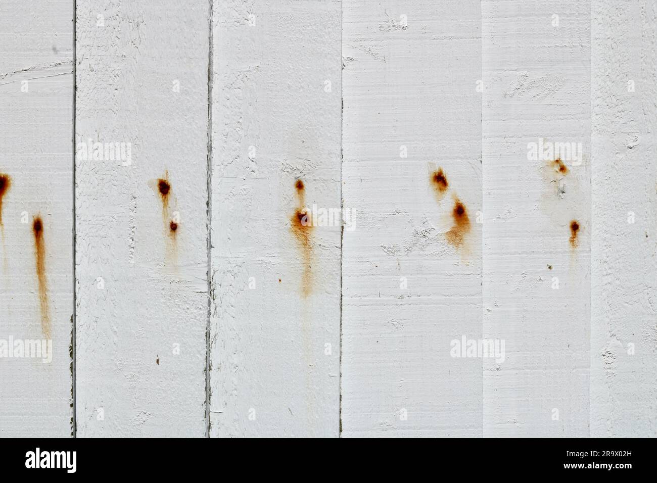 White wooden panelled fence with rust stains and space for copy Stock ...