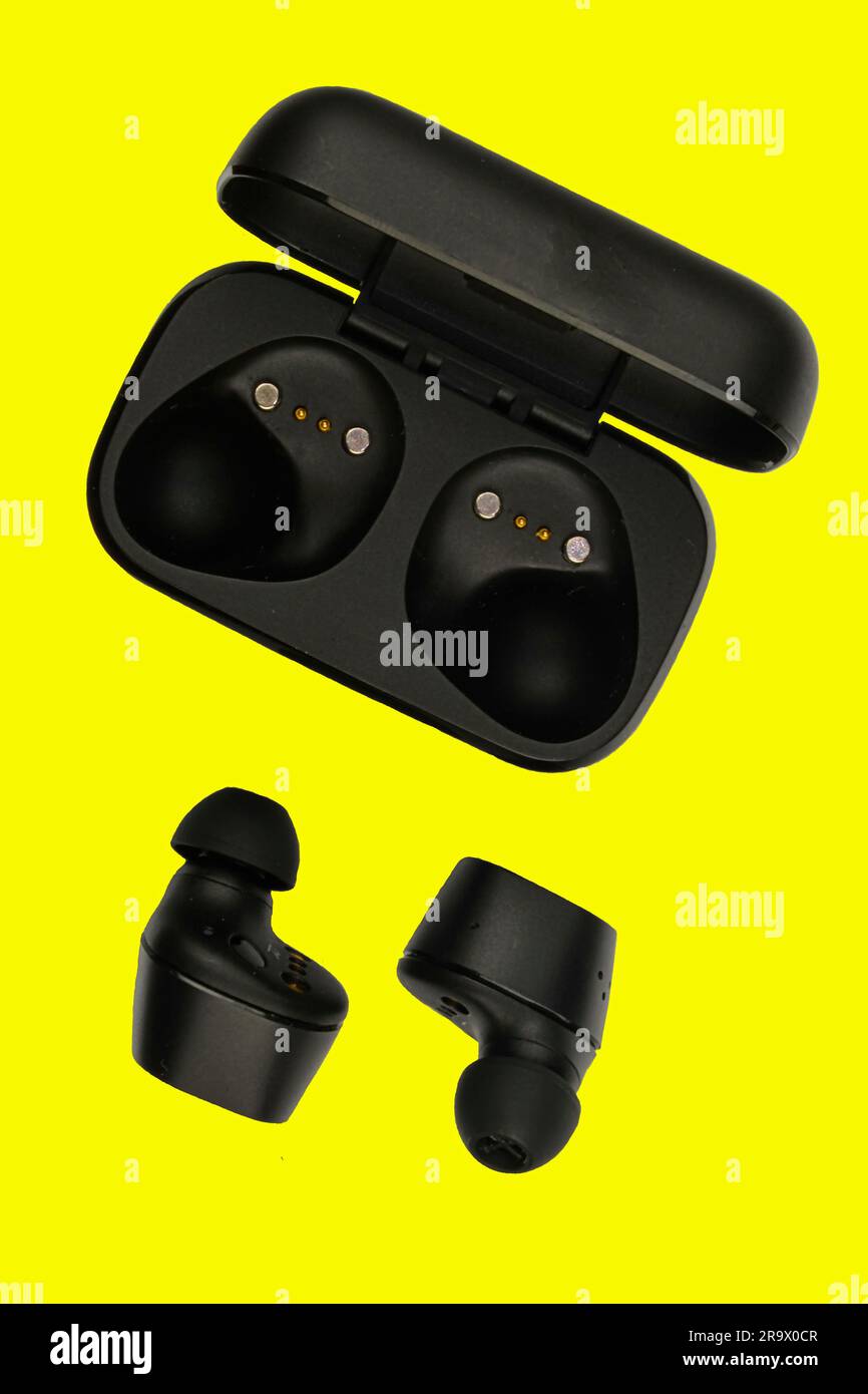 Wireless stereo earbuds. Black wireless earphones and charging case ...