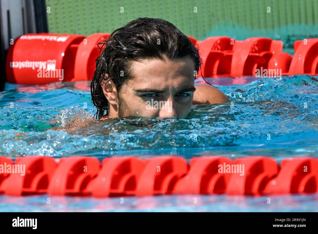 Thomas Ceccon of Italy reacts after compete in the 100m Backstroke Men ...