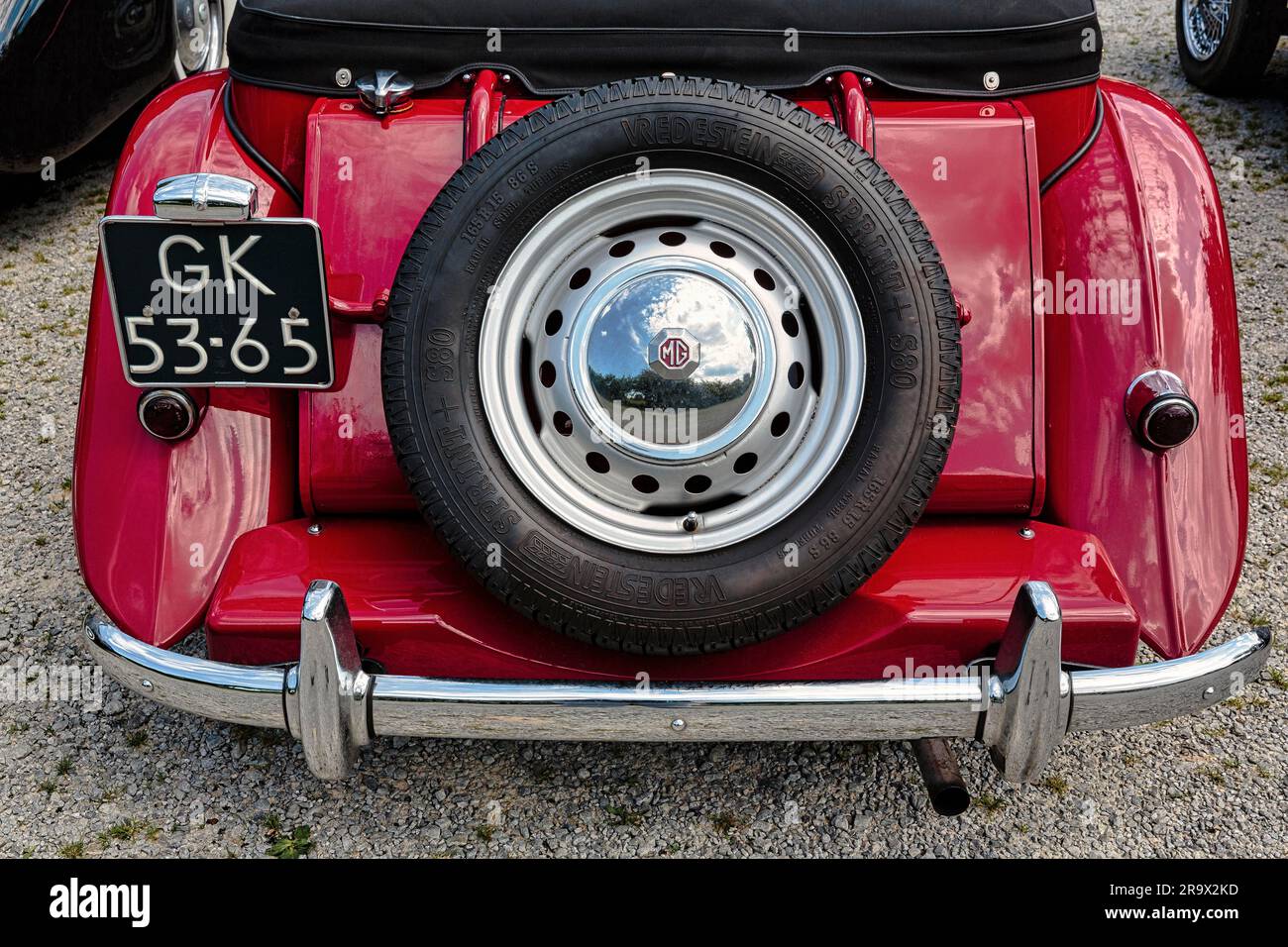 Red MG Roadster convertible, English classic car, rear view, spare ...