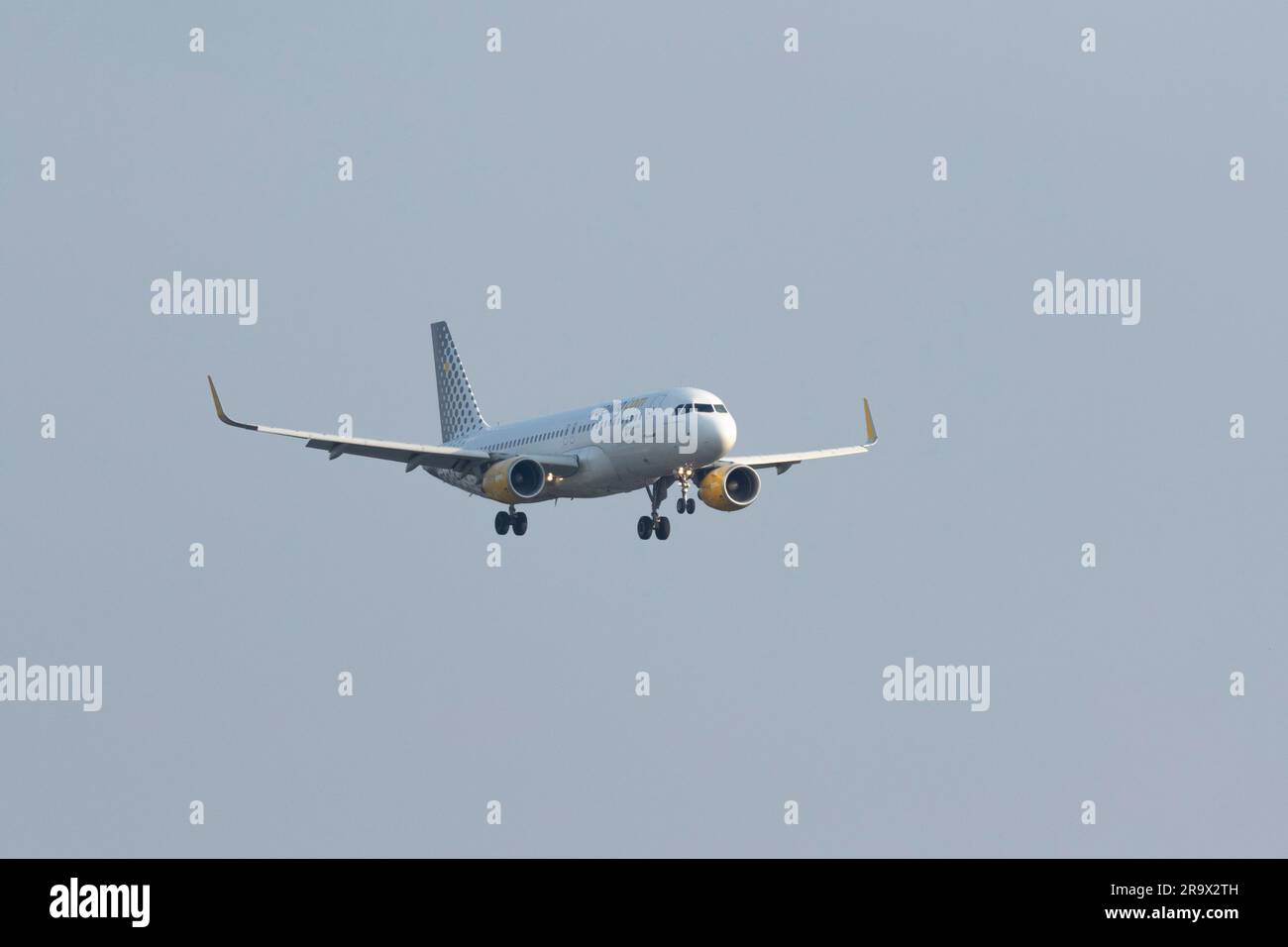 Passenger aircraft Airbus A320-200 of the airline Vueling on approach ...