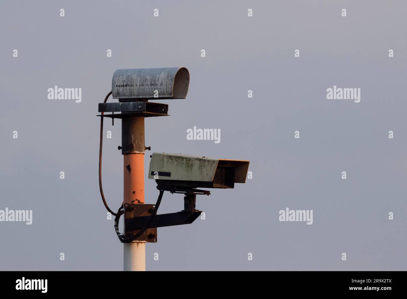 Weathered and rusted CCTV surveillance cameras on the tarmac at Hamburg ...