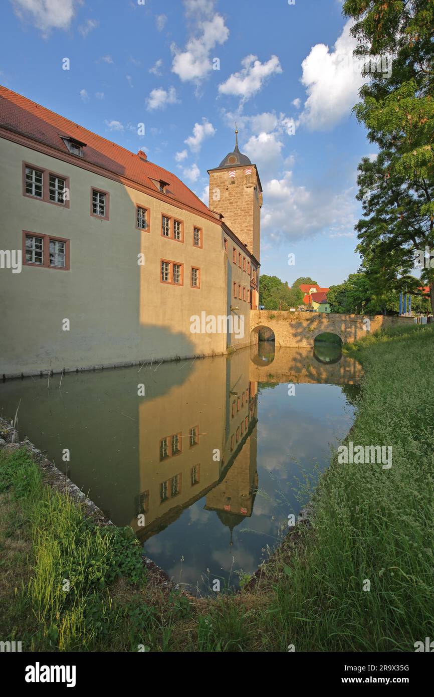 Moated castle built 12th century with tower, arched bridge and ...