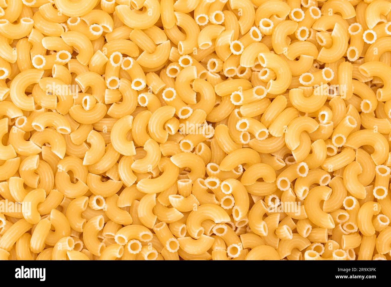 Uncooked Chifferi Rigati Pasta Background. Fat and Unhealthy Food ...